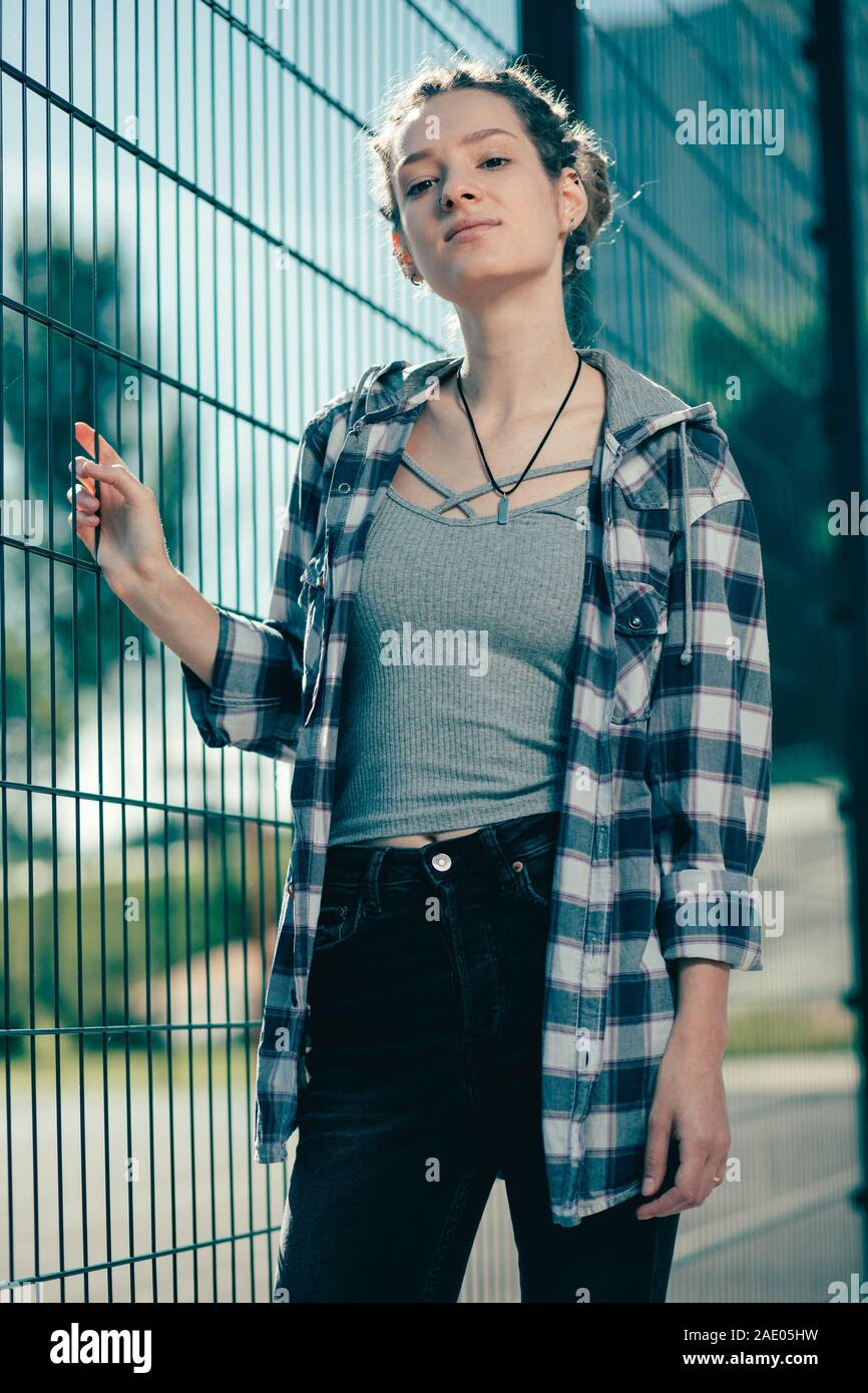 Confident young girl smiling and putting her head up Stock Photo - Alamy