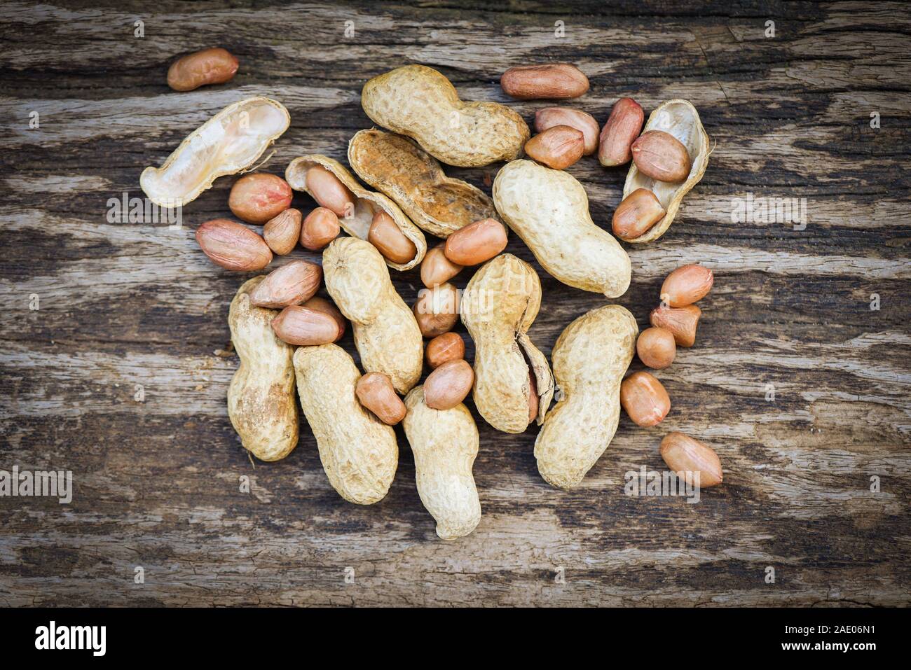 Peanut in shells for food or snack / Roasted peanuts on rustic wood ...