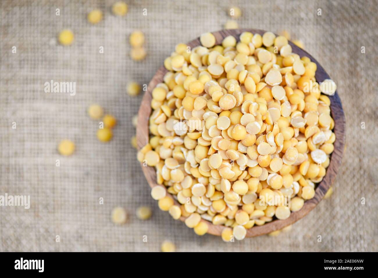 Soybean in a wooden bowl agricultural products on the sack background ...