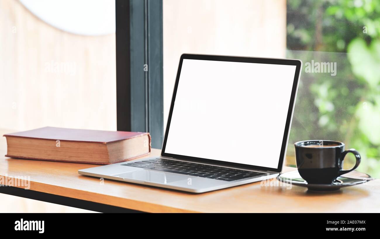 Mockup laptop computer isolated screen with book and coffee cup Stock ...