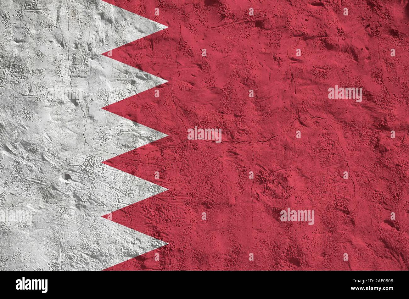 Bahrain flag depicted in bright paint colors on old relief plastering ...