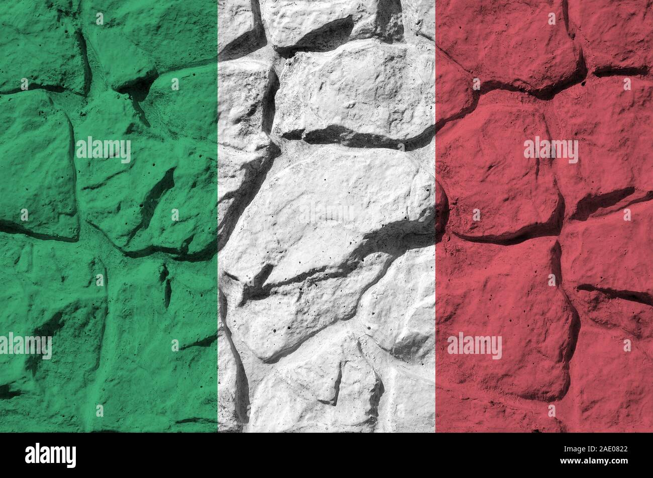 Italy flag depicted in paint colors on old stone wall close up ...