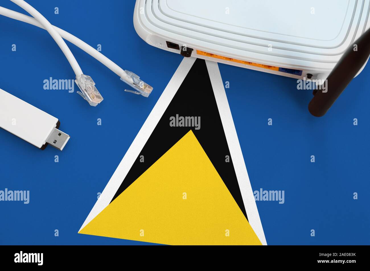 Saint Lucia flag depicted on table with internet rj45 cable, wireless ...