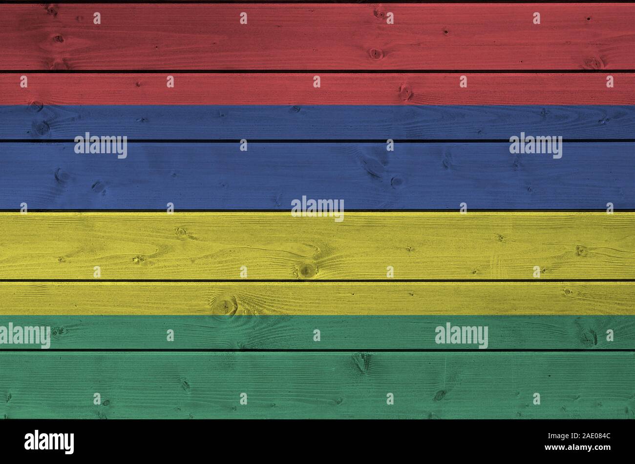 Mauritius flag depicted in bright paint colors on old wooden wall close ...