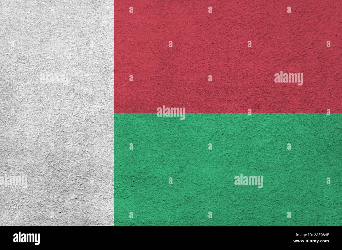 Madagascar flag depicted in bright paint colors on old relief ...