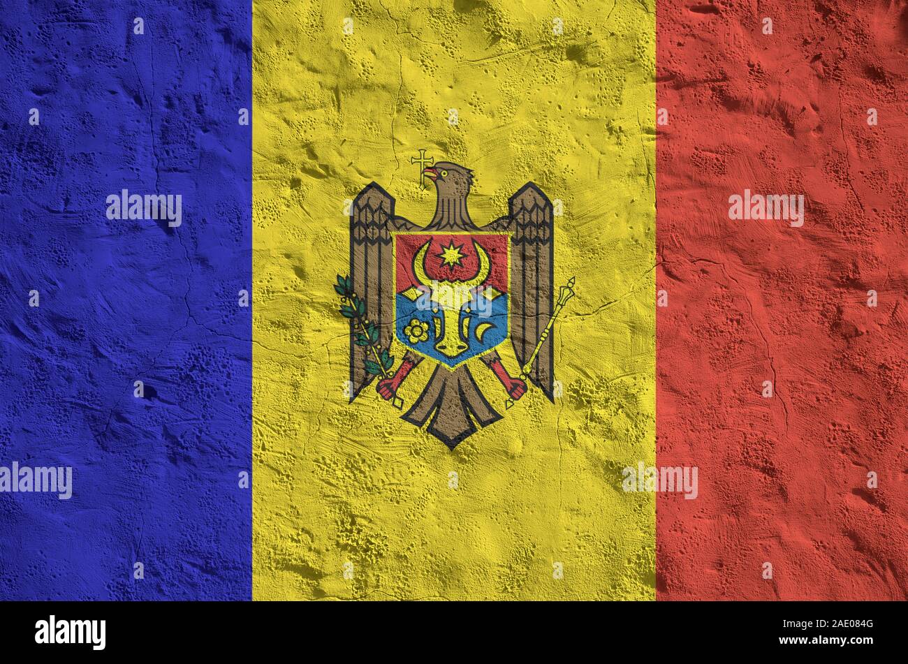 Moldova flag depicted in bright paint colors on old relief plastering ...