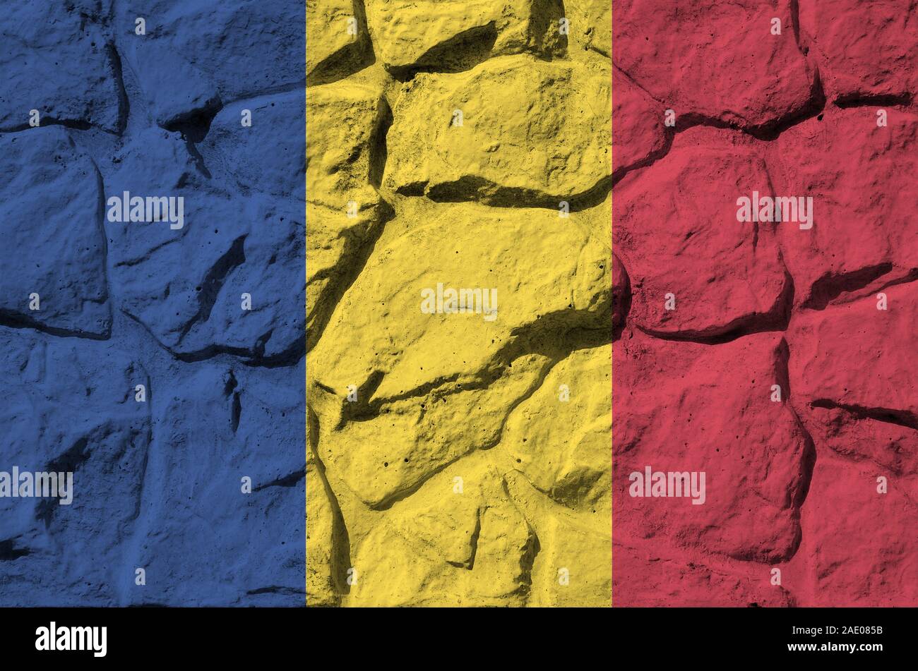 Romania flag depicted in paint colors on old stone wall close up ...