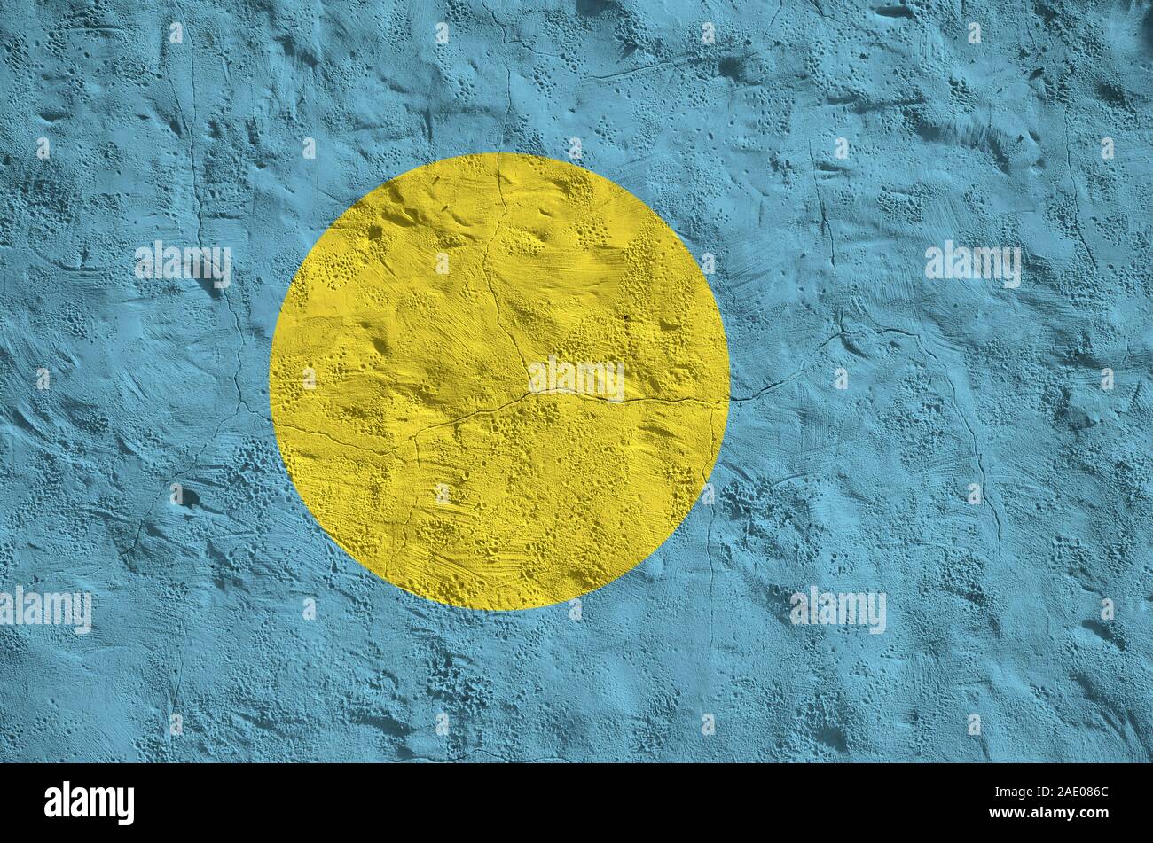 Palau flag depicted in bright paint colors on old relief plastering ...