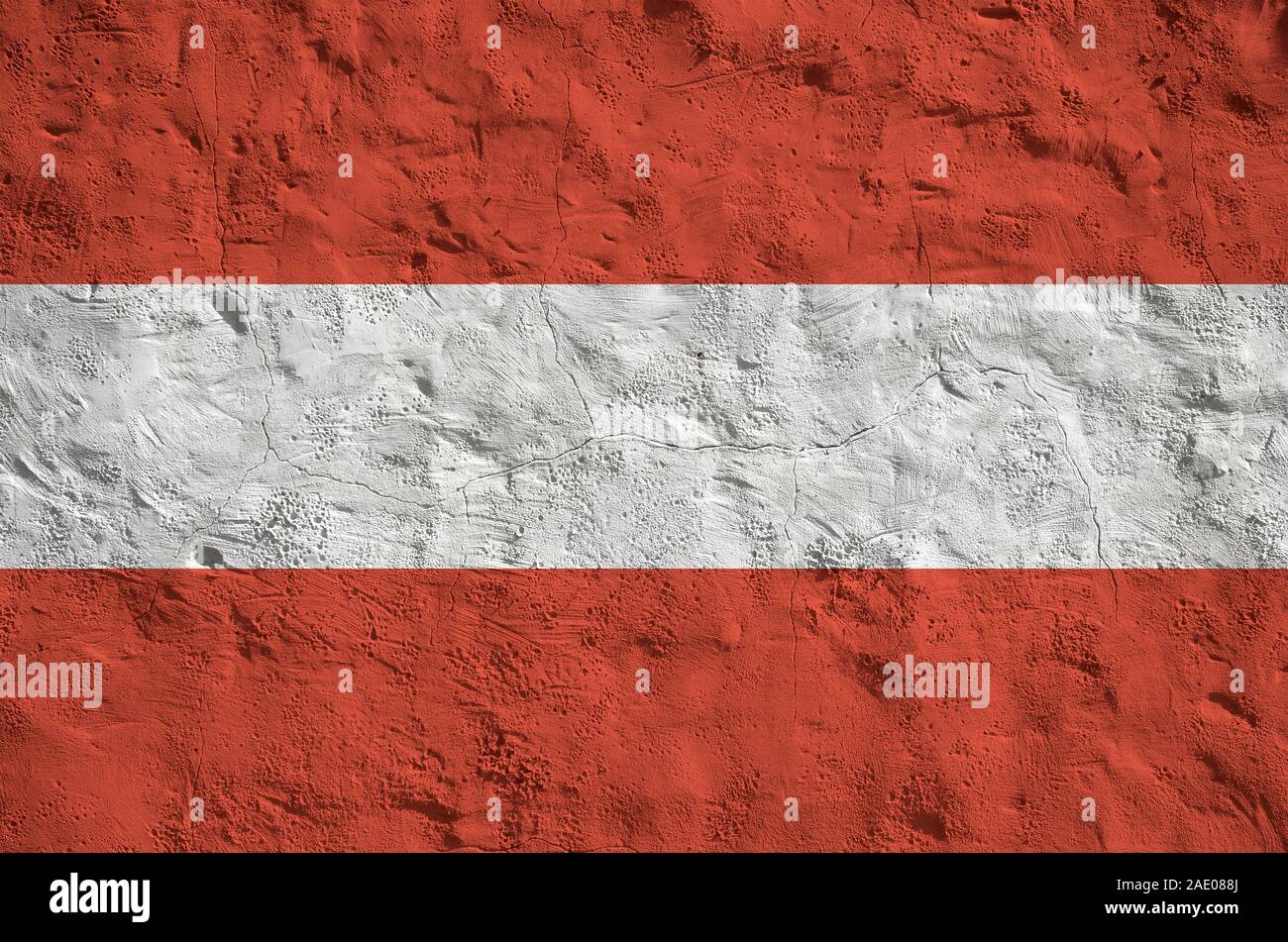 Austria flag depicted in bright paint colors on old relief plastering ...