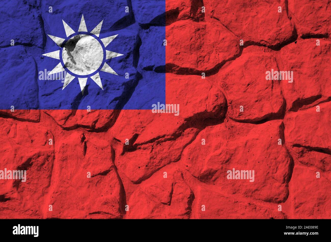 Taiwan flag depicted in paint colors on old stone wall close up ...