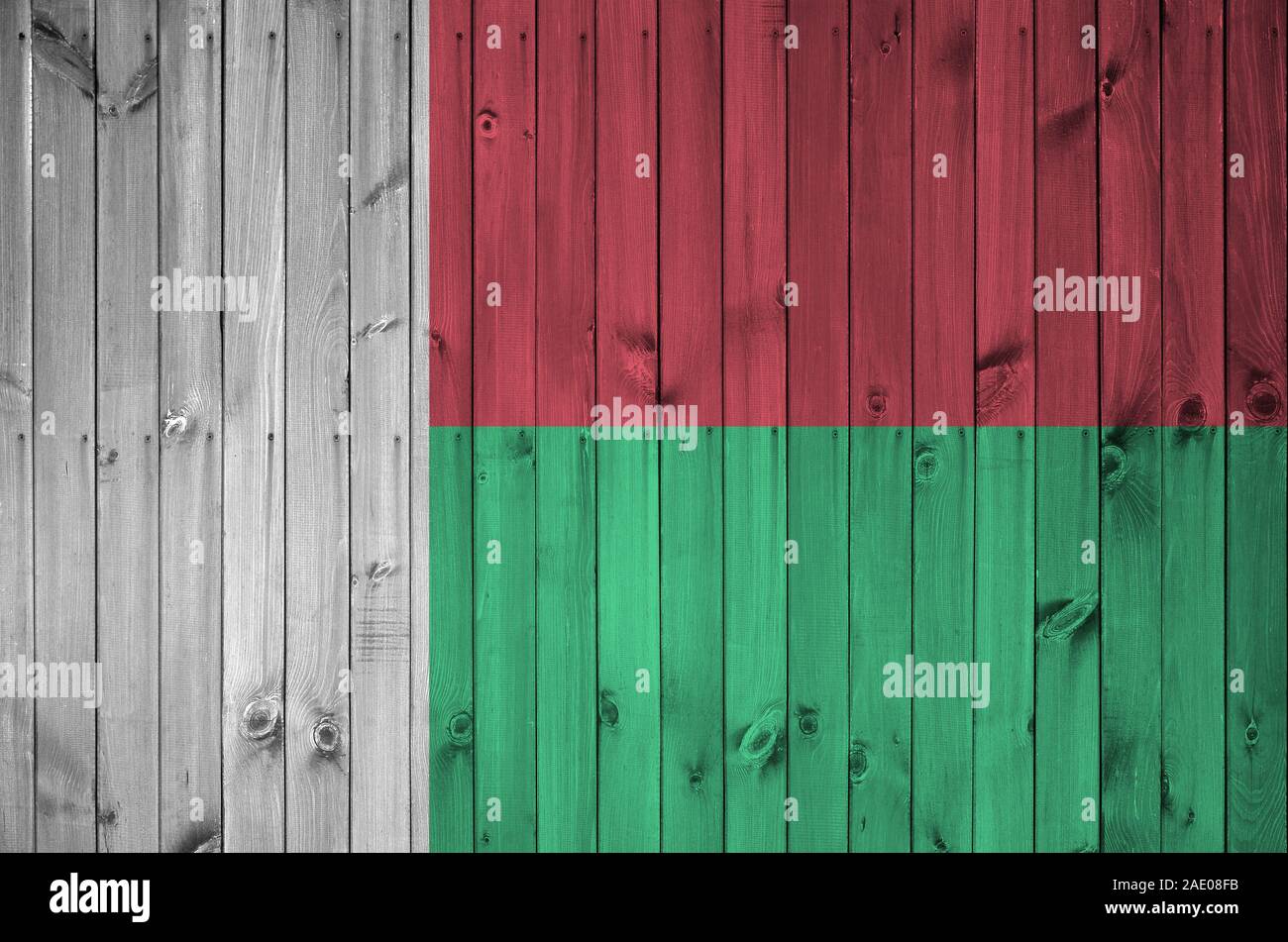 Madagascar flag depicted in bright paint colors on old wooden wall ...