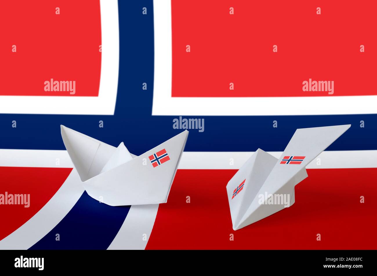 Norway flag depicted on paper origami airplane and boat. Oriental ...