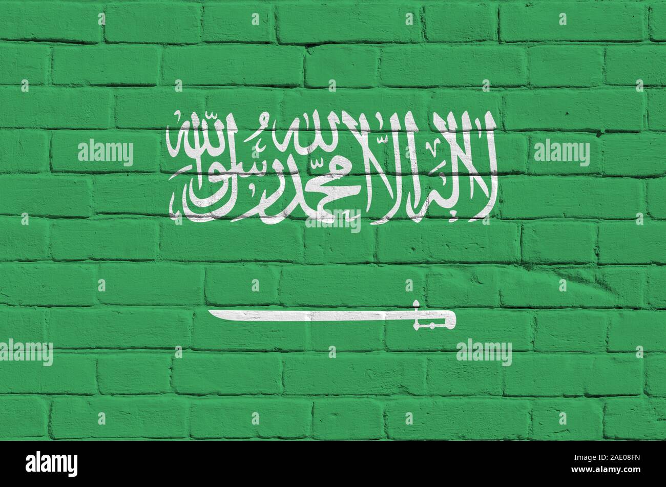 Saudi Arabia flag depicted in paint colors on old brick wall close up ...