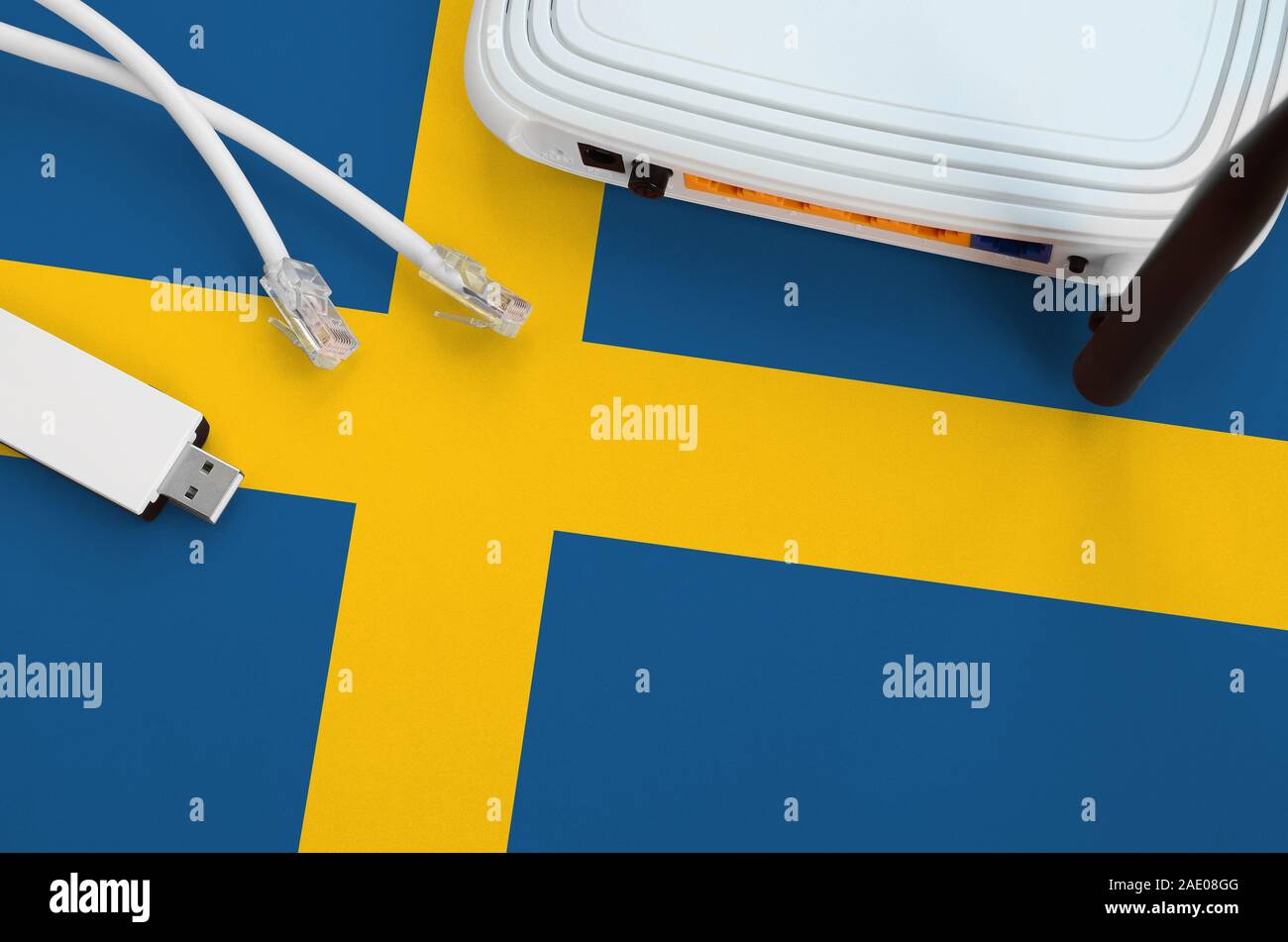 Sweden flag depicted on table with internet rj45 cable, wireless usb wi ...
