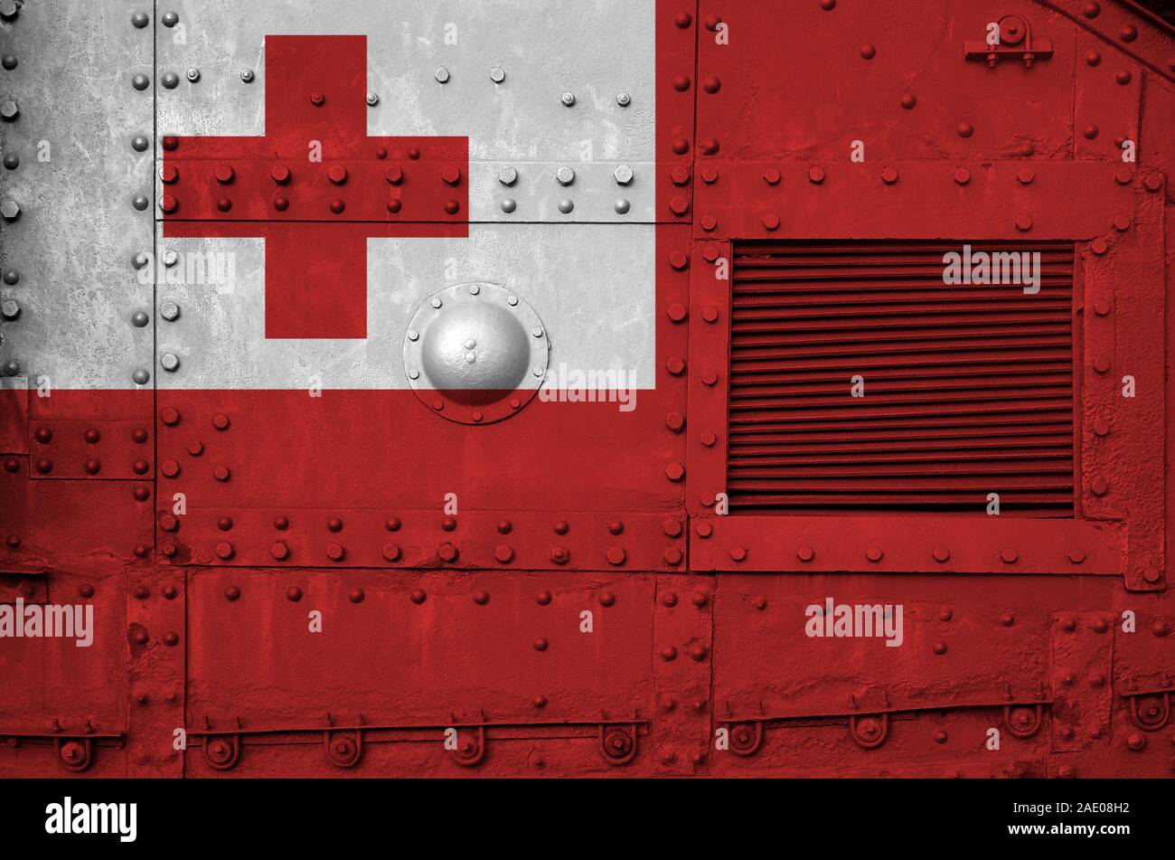 Tonga flag depicted on side part of military armored tank close up ...