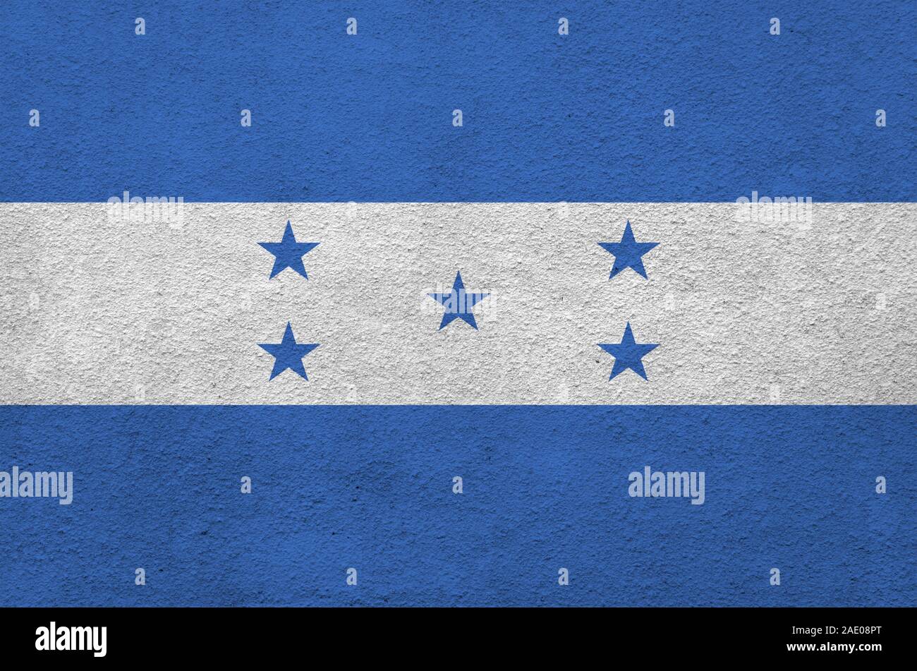 Honduras flag depicted in bright paint colors on old relief plastering ...