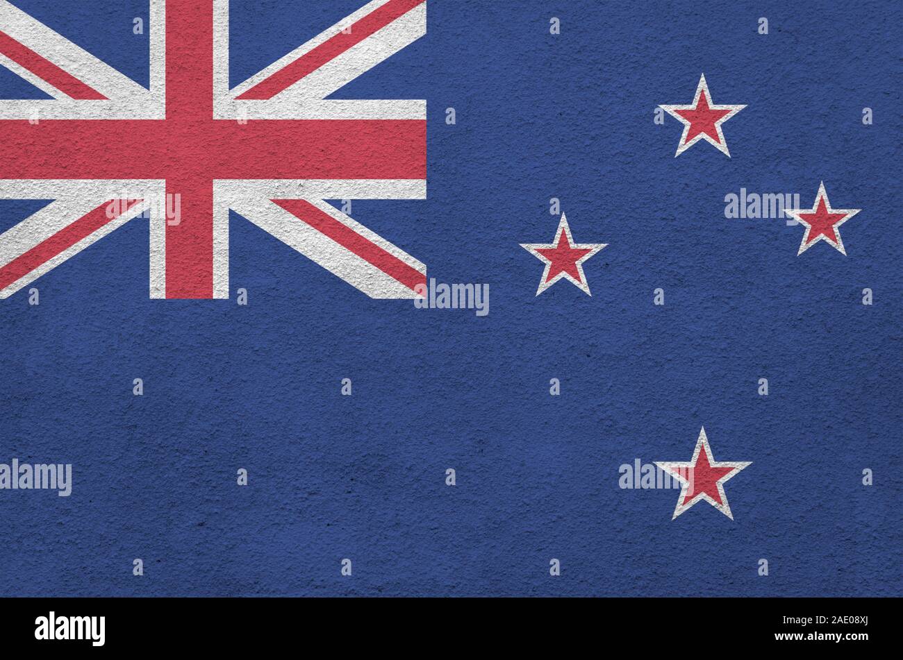 New Zealand flag depicted in bright paint colors on old relief ...
