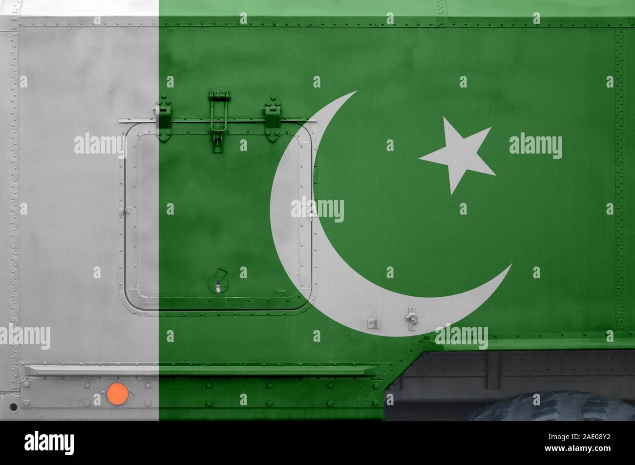 Pakistan flag depicted on side part of military armored truck close up ...