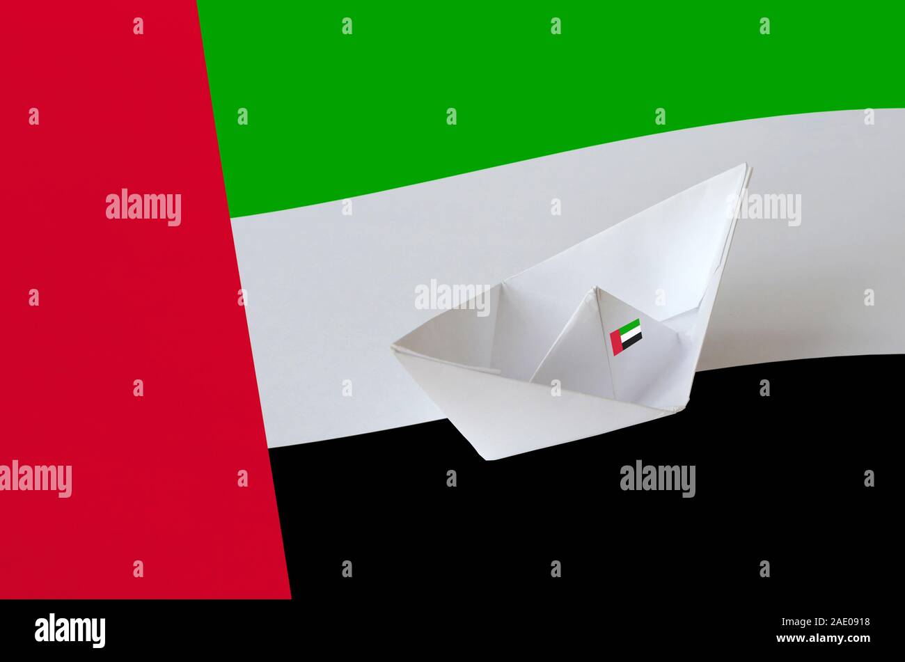 United Arab Emirates flag depicted on paper origami ship closeup ...