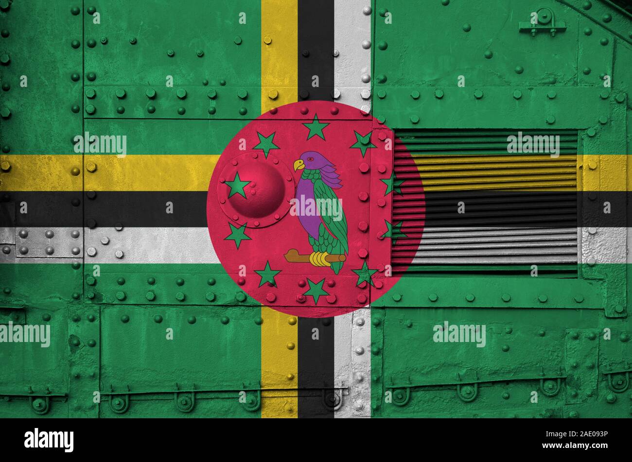 Dominica flag depicted on side part of military armored tank close up ...