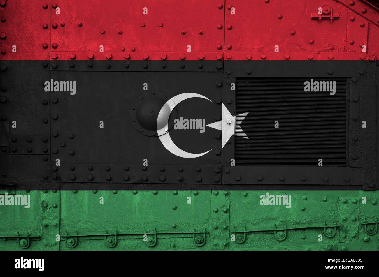 Libya flag depicted on side part of military armored tank close up ...