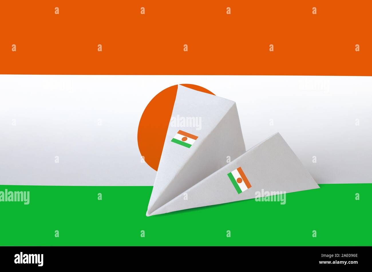 Niger flag depicted on paper origami airplane. Oriental handmade arts ...