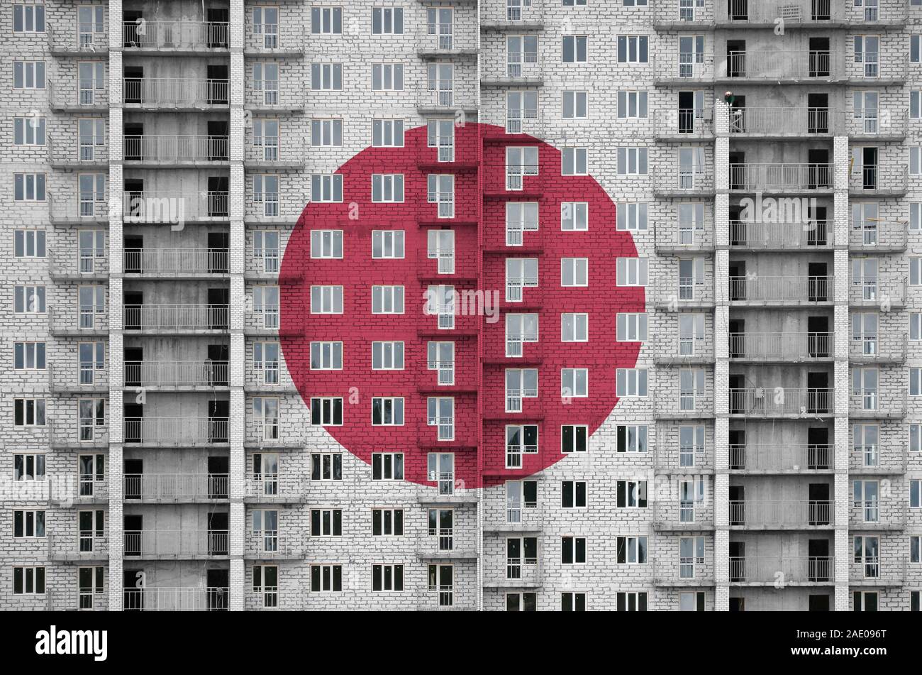 Japan flag depicted in paint colors on multi-storey residental building ...