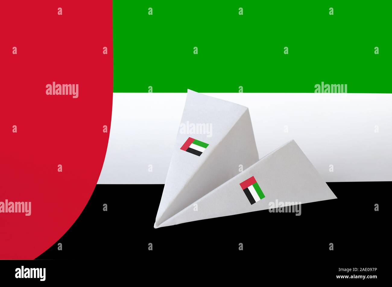 United Arab Emirates flag depicted on paper origami airplane. Oriental ...