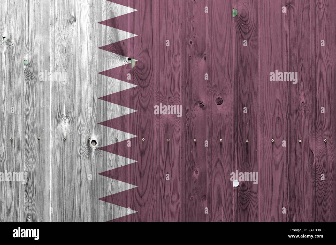 Qatar flag depicted in bright paint colors on old wooden wall close up ...