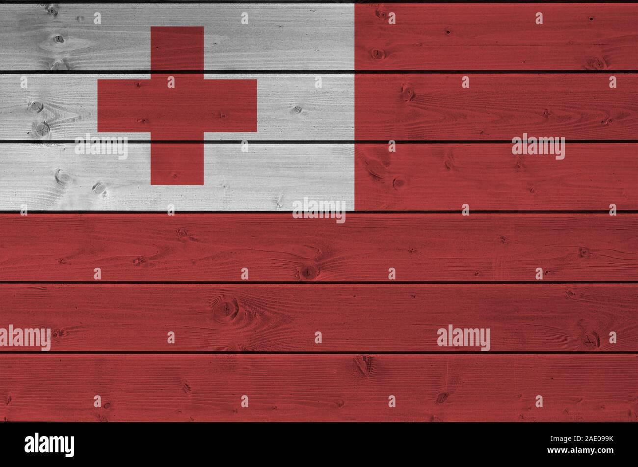 Tonga flag depicted in bright paint colors on old wooden wall close up ...