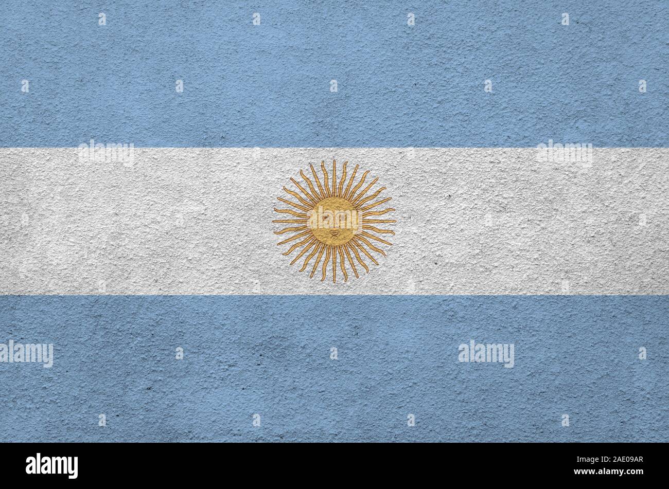 Argentina flag depicted in bright paint colors on old relief plastering ...