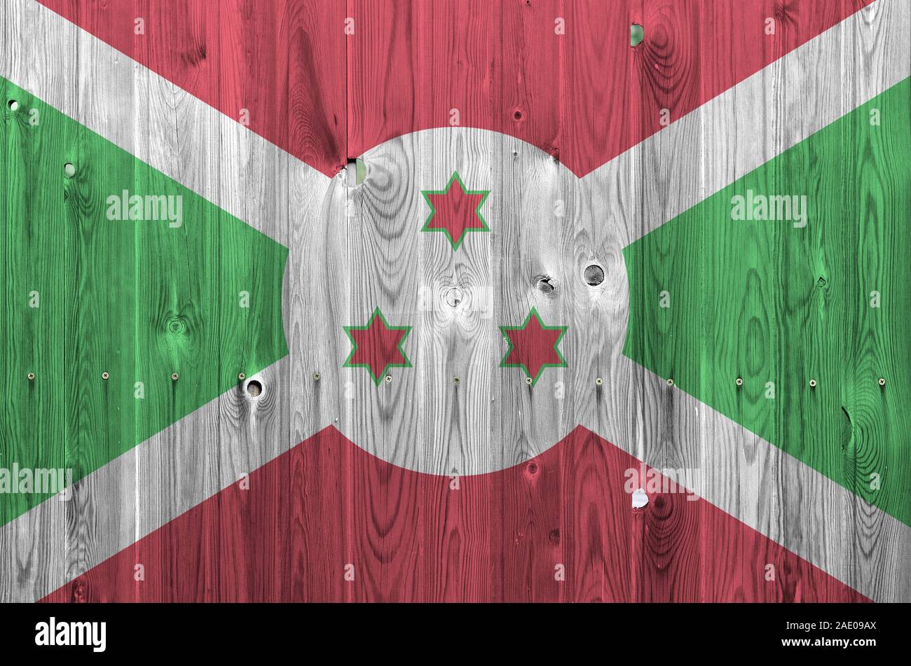 Burundi flag depicted in bright paint colors on old wooden wall close ...