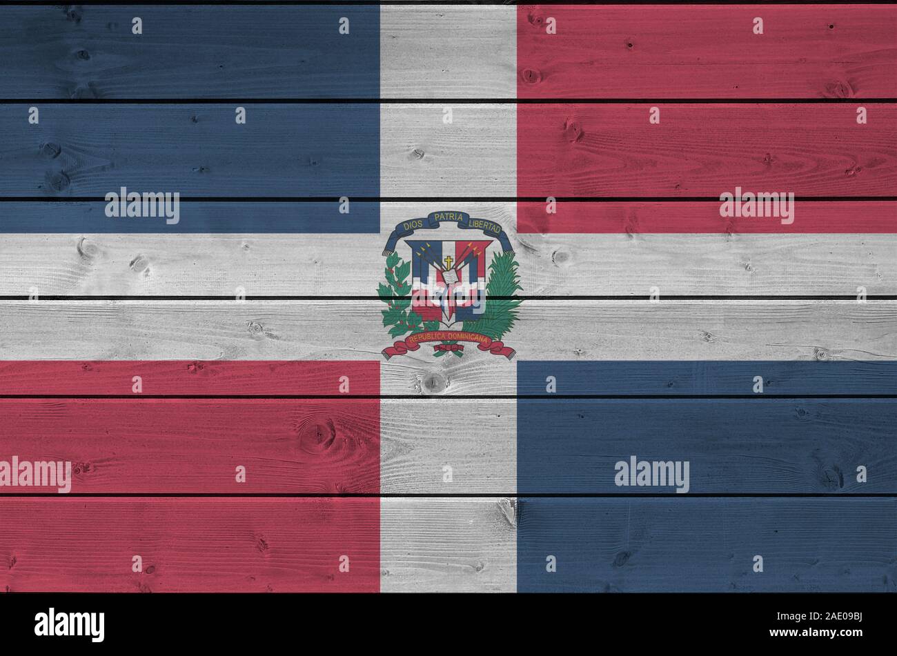 Dominican Republic flag depicted in bright paint colors on old wooden ...