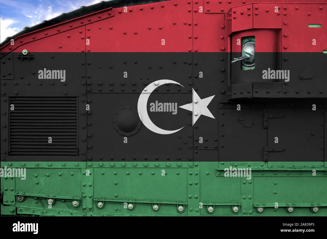 Libya flag depicted on side part of military armored tank close up ...
