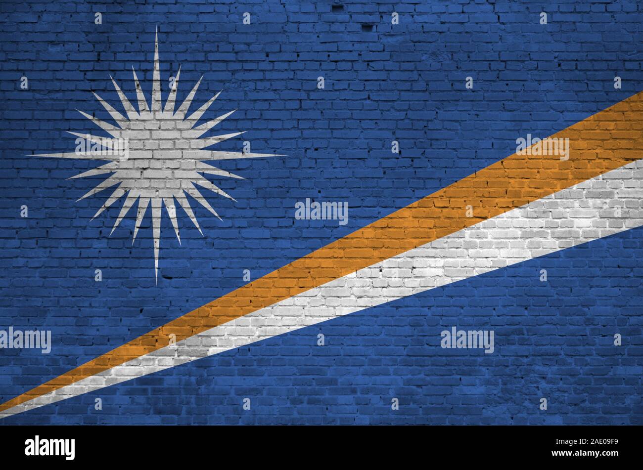 Marshall Islands flag depicted in paint colors on old brick wall close ...