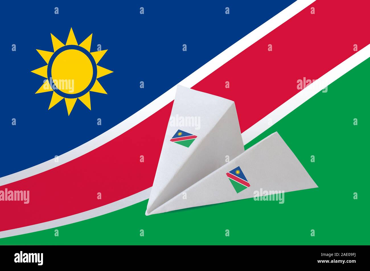 Namibia flag depicted on paper origami airplane. Oriental handmade arts ...