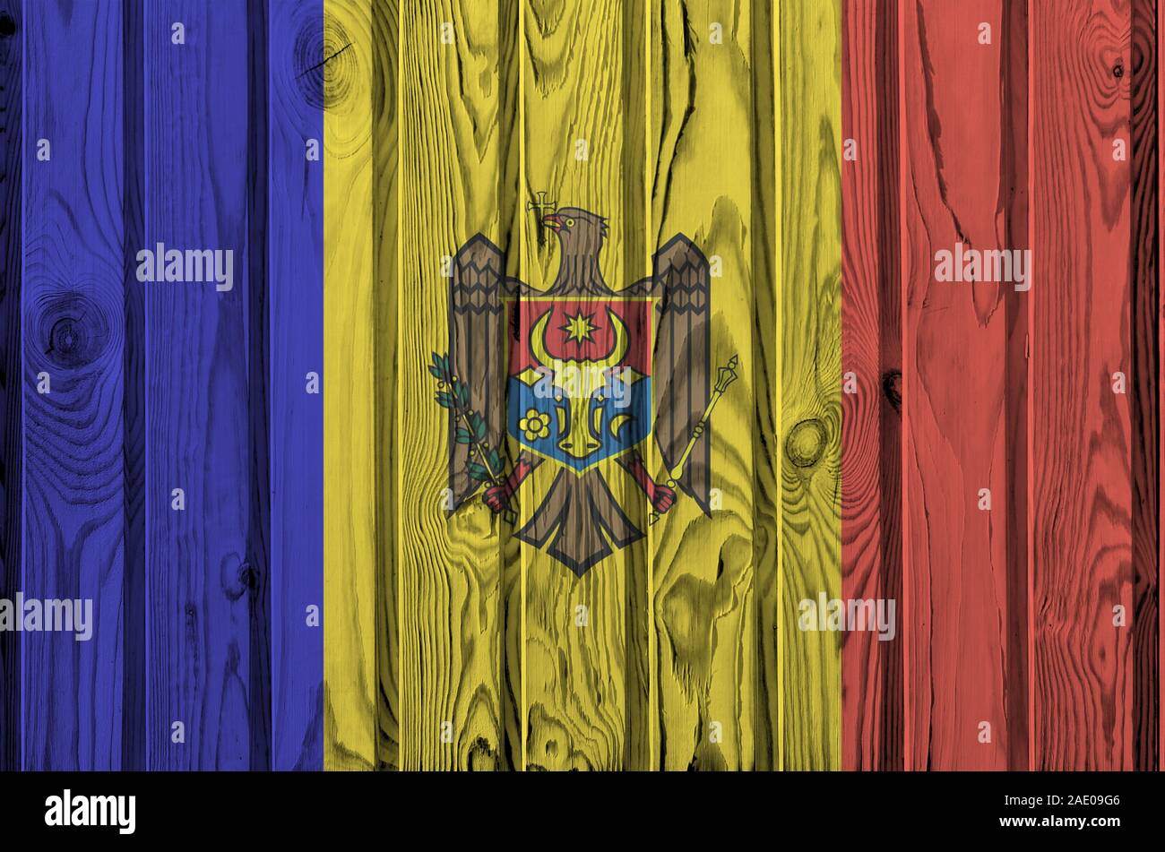 Moldova flag depicted in bright paint colors on old wooden wall close ...