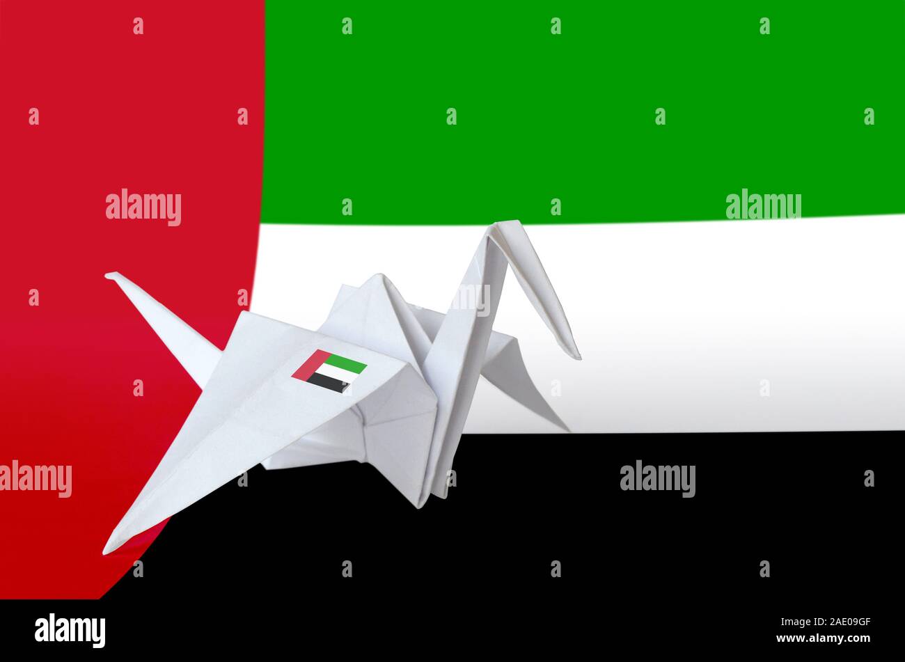 United Arab Emirates flag depicted on paper origami crane wing ...