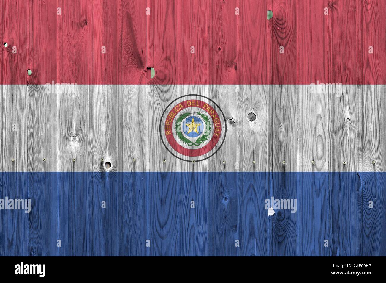 Paraguay flag depicted in bright paint colors on old wooden wall close ...