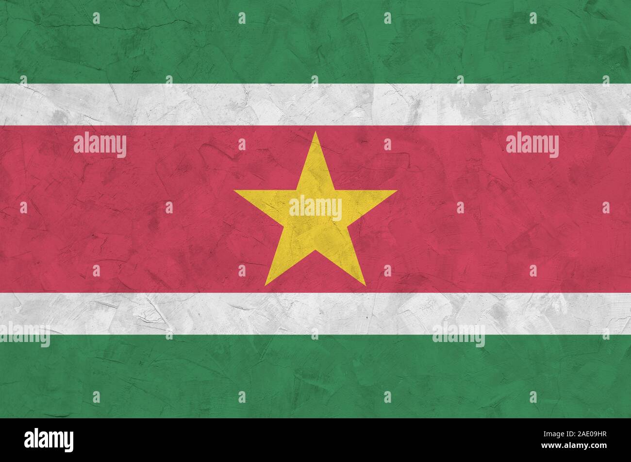 Suriname flag depicted in bright paint colors on old relief plastering ...