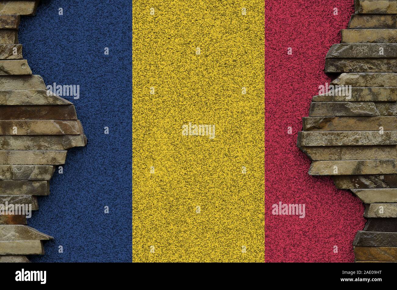 Chad flag depicted in paint colors on old stone wall close up. Textured ...