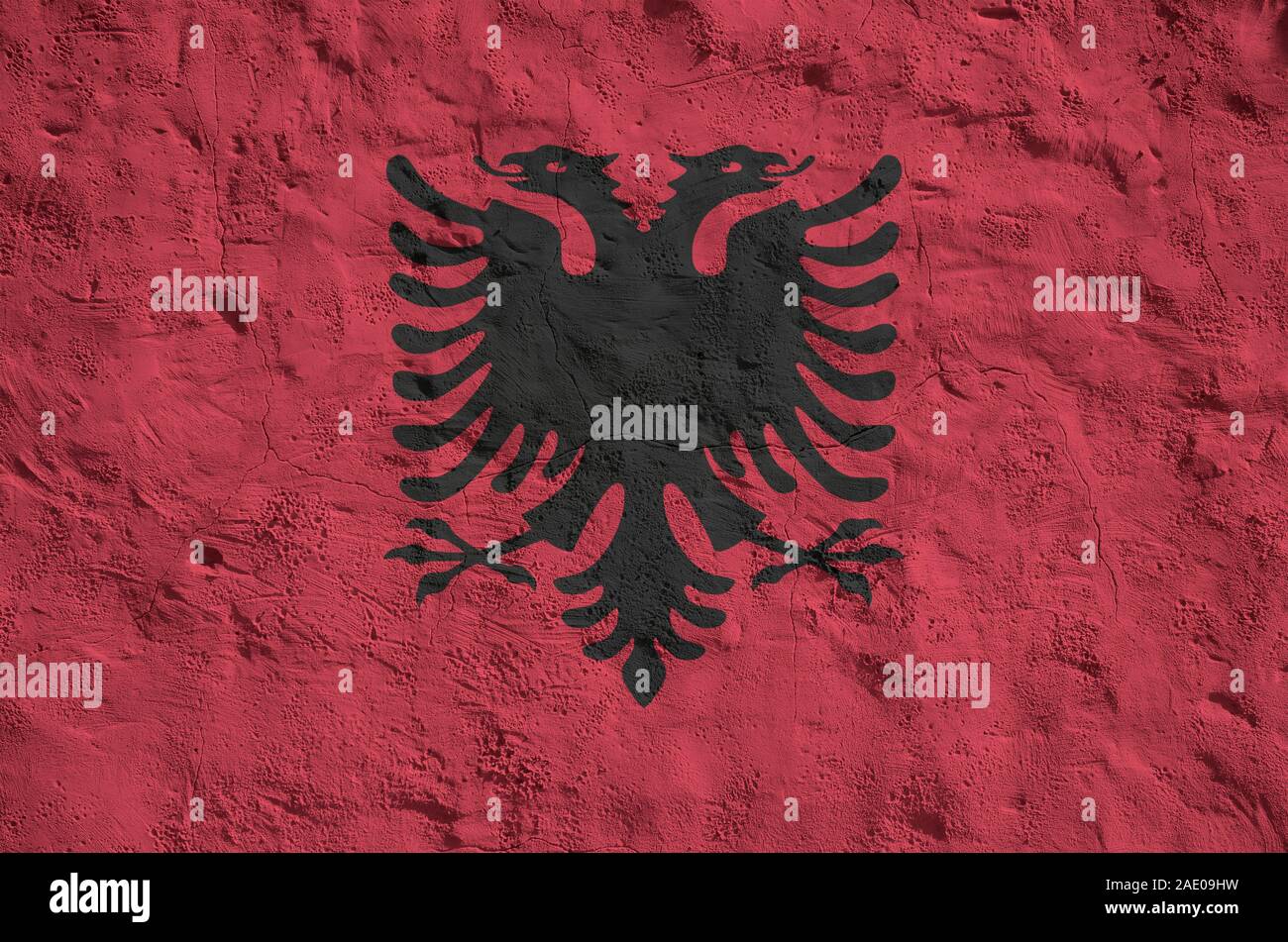 Albania flag depicted in bright paint colors on old relief plastering ...