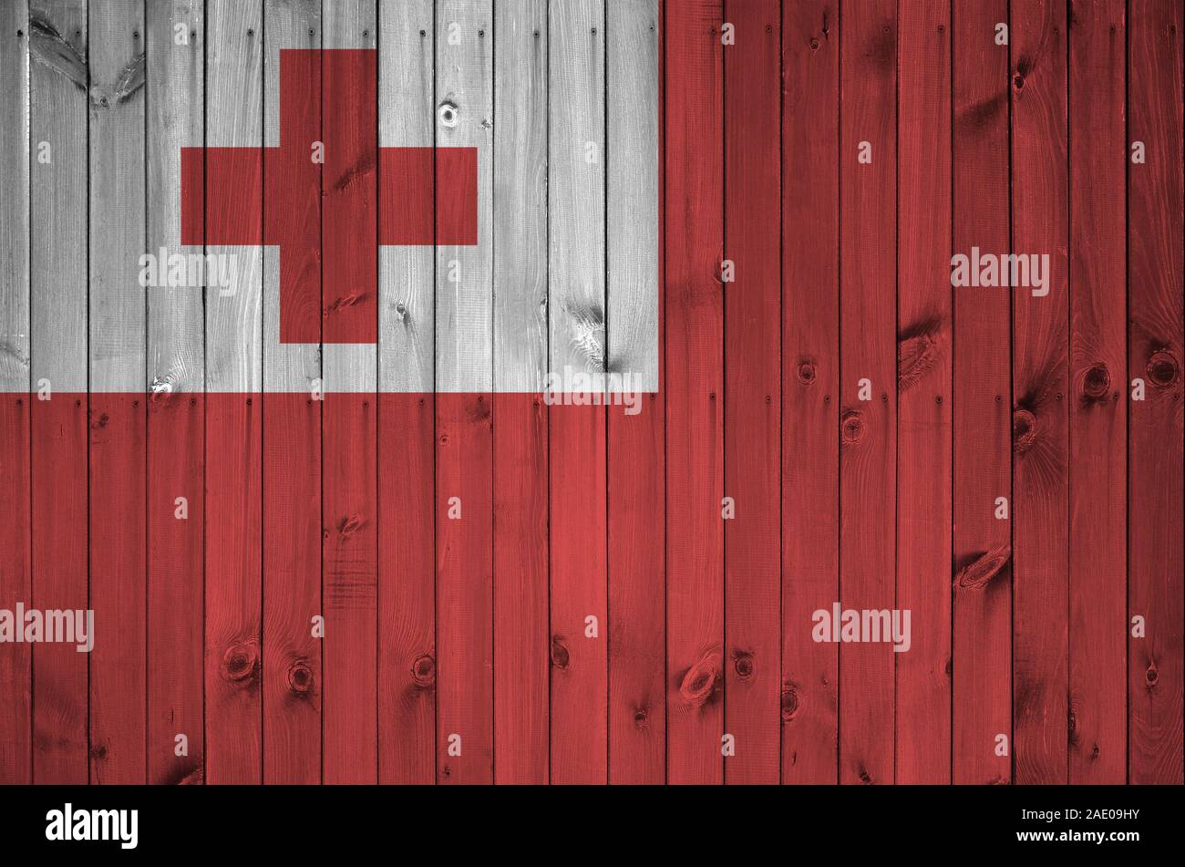 Tonga flag depicted in bright paint colors on old wooden wall close up ...