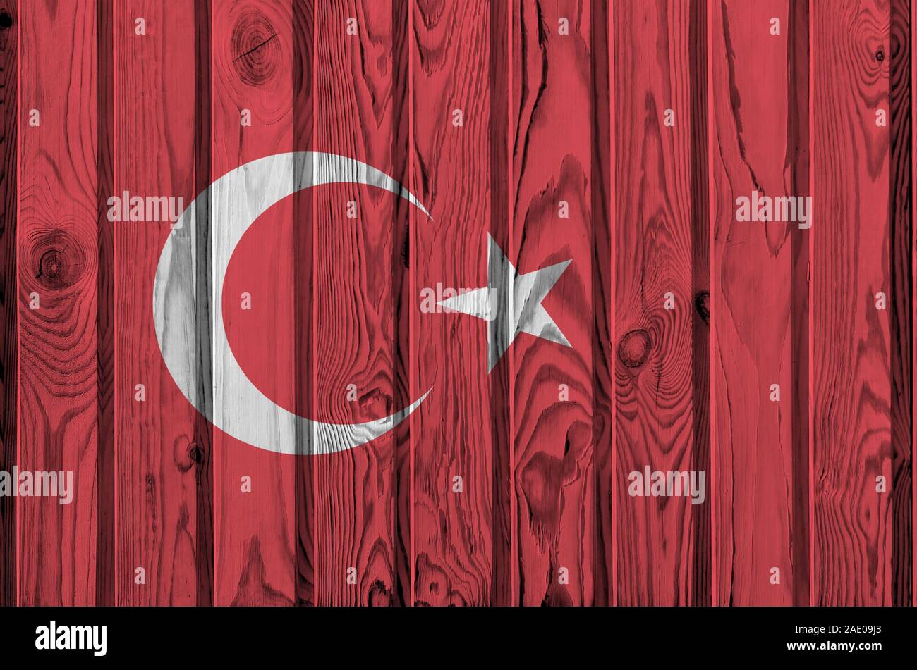 Turkey flag depicted in bright paint colors on old wooden wall close up ...