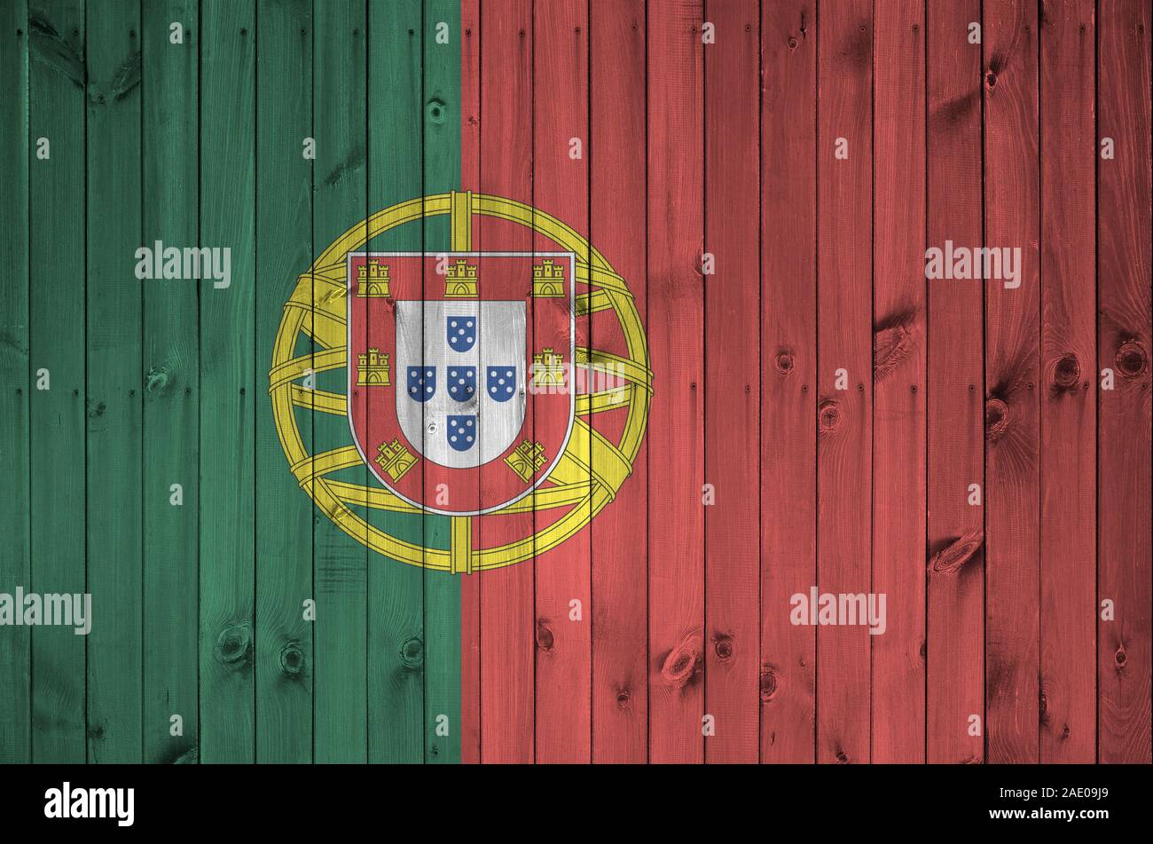 Portugal flag depicted in bright paint colors on old wooden wall close ...