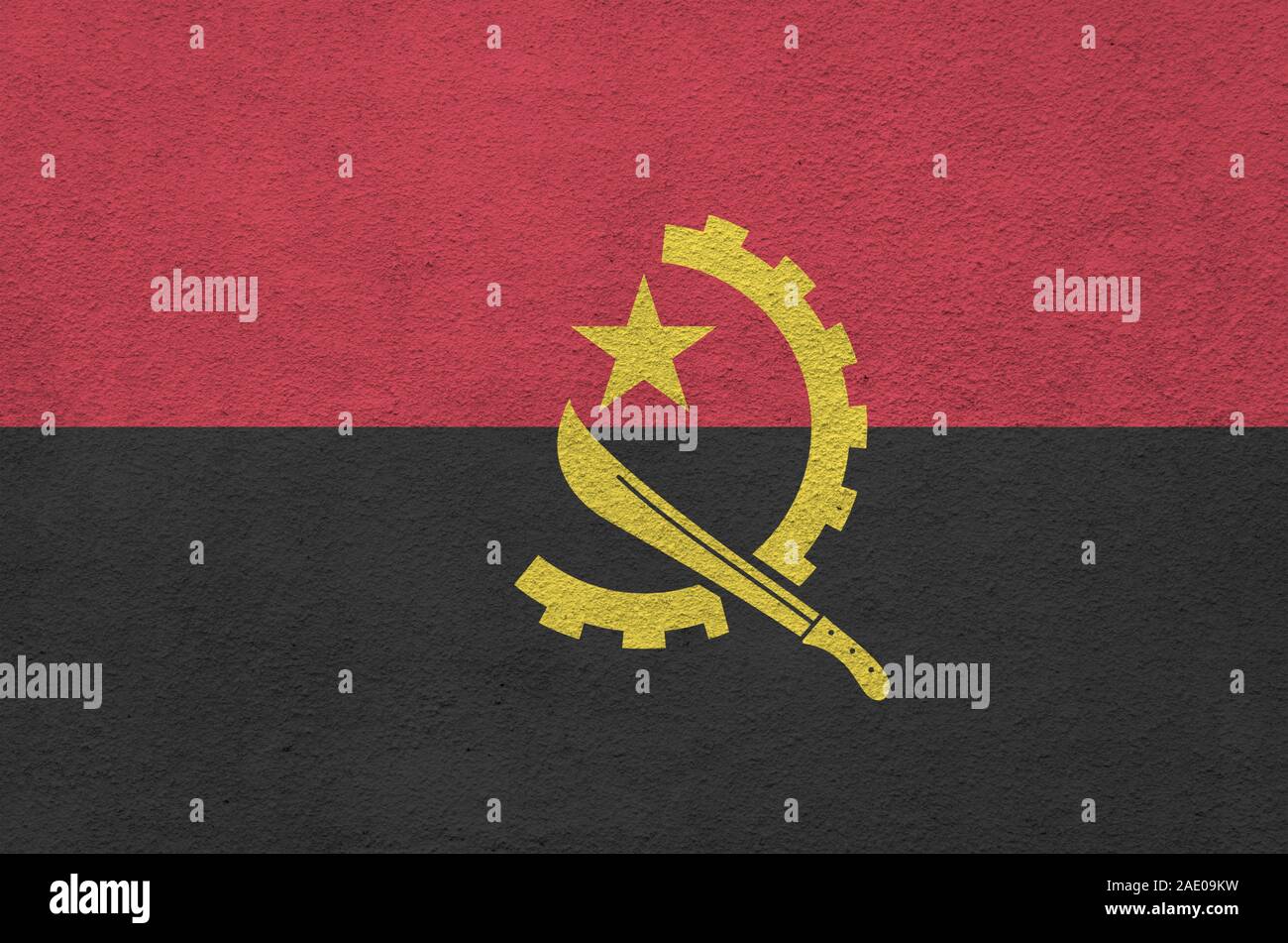 Angola flag depicted in bright paint colors on old relief plastering ...