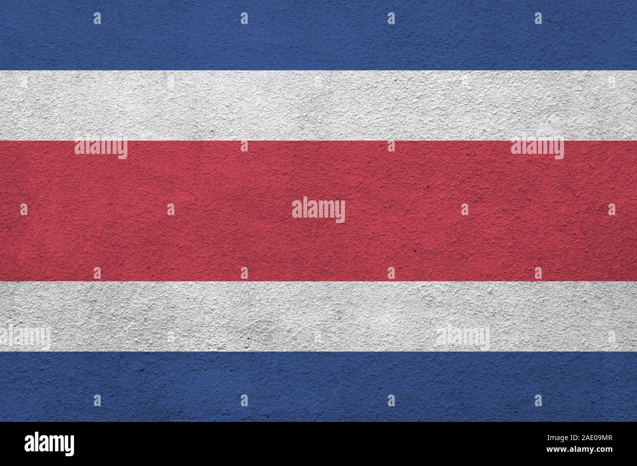 Costa Rica flag depicted in bright paint colors on old relief ...