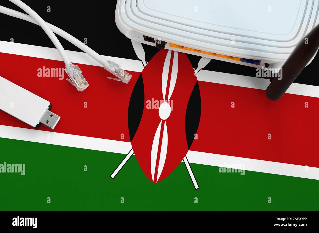 Kenya flag depicted on table with internet rj45 cable, wireless usb wi ...