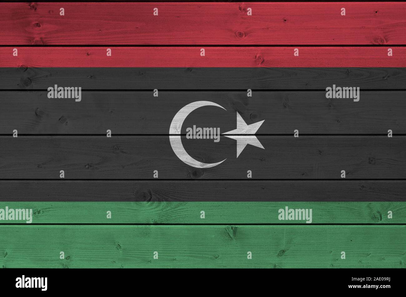 Libya flag depicted in bright paint colors on old wooden wall close up ...
