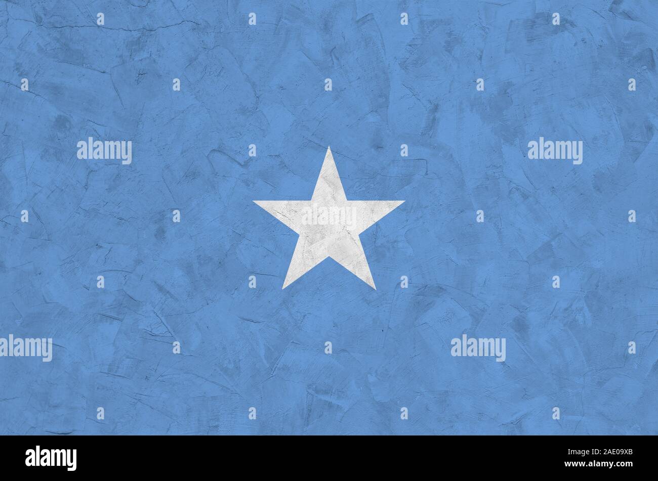 Somalia flag depicted in bright paint colors on old relief plastering ...